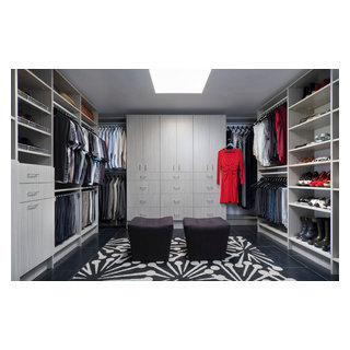 Concrete Walk-in Closet with Custom Wardrobe Centerpiece - Modern ...