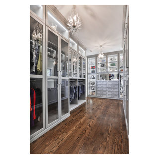 Walk-in Closet Featuring Glass Inserted Doors And LED Lights ...