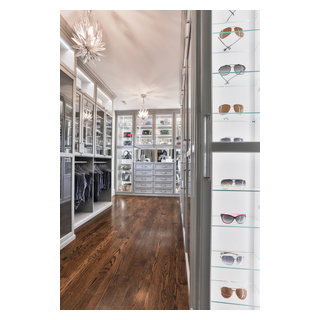 Walk-in Closet Featuring Glass Inserted Doors And LED Lights ...