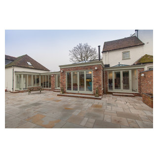 Large Orangery with multiple Lanterns, mutifold doors and link to ...