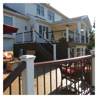 Bi-level deck design with covered deck and patio area - Traditional ...