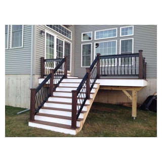 Dark brown Trex deck with contemporary metal railing - Contemporary ...