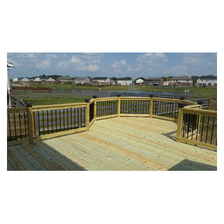 Octagonal wood deck with black aluminum balusters, and solar post caps ...