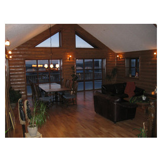Half log siding creates a cozy feel and rich look - Rustic - Dining ...