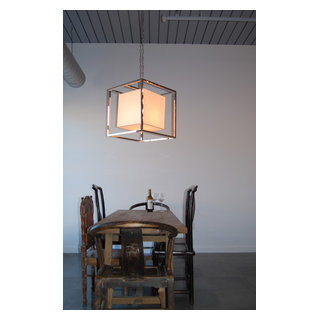 Modern loft dining space with antique asian table and chairs ...