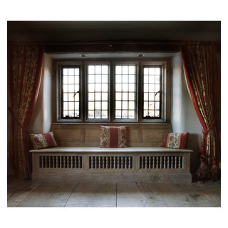Traditional farmhouse window seat and stone mullion windows ...