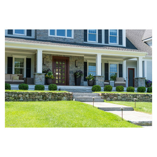 Granite-detailed steps set the stage for the approach to the front ...