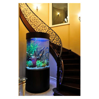Stunning Cylinder Aquarium with Wrap Around Staircase - Mediterranean ...