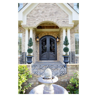 Intricate Iron Door Scrollwork to Complement a Home's Other ...