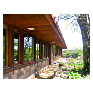 Broad roof overhangs with plywood soffits, and custom metal roof ...