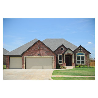 Dark Red Brick Home with Stone Around Windows and Garage - Traditional ...