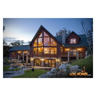 Incredible exterior view of a log home with prow widow wall - Rustic ...