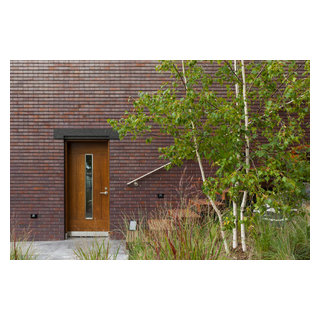 Lac La Belle - Modern Brick Lake Home with Dock and Boathouse - Modern ...