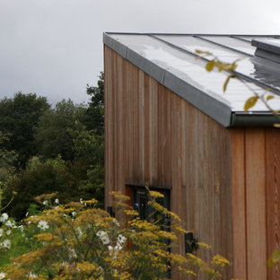 75 Beautiful Board and Batten Exterior Home with a Clipped Gable Roof ...