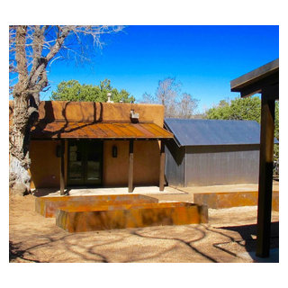 Stucco with corten steel roof, corrugated steel shed, steel planter ...