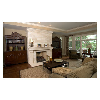 Keeping Room with Floor to Ceiling Cut Limestone Fireplace and Tray ...