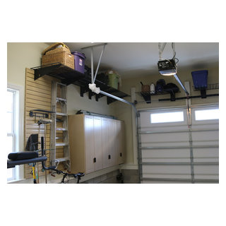 Deep, single wide garage features work bench and exercise area ...