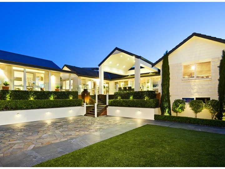 An example of a partial sun backyard stone landscaping. - Melisa Shaye