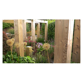 Posts & Perennials - Oak arches and Alliums. - Contemporary - Landscape ...