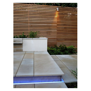 Small garden enhanced visually with horizontal Western Red Cedar ...