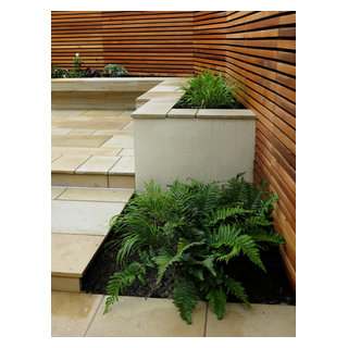 Small garden enhanced visually with horizontal Western Red Cedar ...