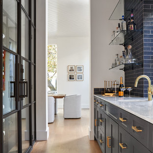 75 Beautiful Home Bar with Recessed-Panel Cabinets and Brown Backsplash ...