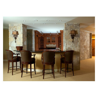 Curved basement wet bar in cherry set into stone columns - Clásico ...
