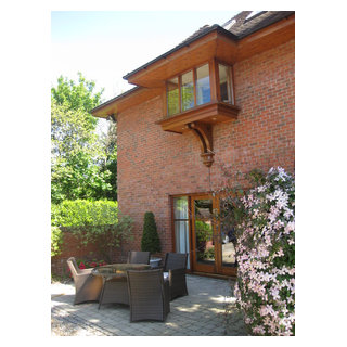 Edwin lutyens styled home with heavy overhanging eaves - Traditional ...