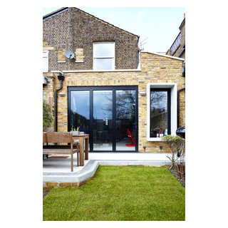 Rear extension with closed bi-fold door and concrete decking - Exterior ...