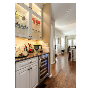 Adjoining butlers pantry with open shelving and wine refrigerator ...