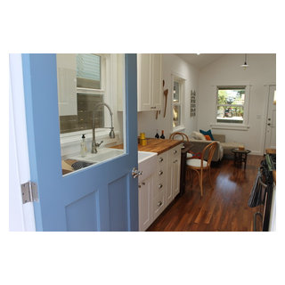 Blue Door Opens Onto Kitchen with White Cabinets - Eclectic - Kitchen ...