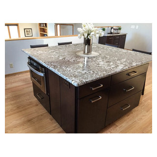 Cherry cabinets with slab doors, a custom-mixed stain, Bianco Antico ...