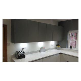 Contemporary, matt grey kitchen & contrasting dark grey wall units ...