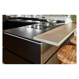 Handle-less Black kitchen with Copper accents & bespoke Concrete ...