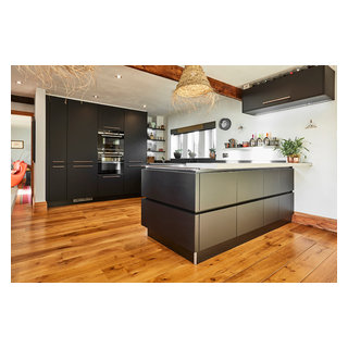 Handle-less Black kitchen with Copper accents & bespoke Concrete ...