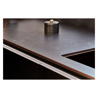 Handle-less Black kitchen with Copper accents & bespoke Concrete ...