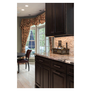 Hidden outlets and LED recessed lighting in a split rock backsplash ...