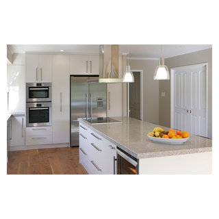 Kitchen Island featuring hob and canopy with wine chiller ...