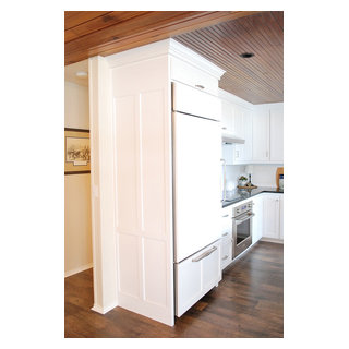 Paneled refrigerator door and drawer with lift-up door above ...