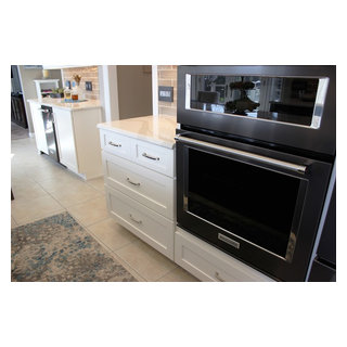 Quad Cities Kitchen With Gray Base Cabinets and Waterfall Counters ...
