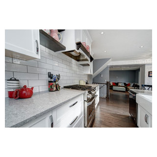 Range counter area and custom hood canopy above. - Craftsman - Cucina ...