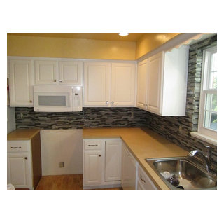 Stone and glass mosaic backsplash - wrapped window - Traditional ...