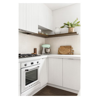 Coastal Kitchen with V-groove Cabinets and White Benchtops - Beach ...