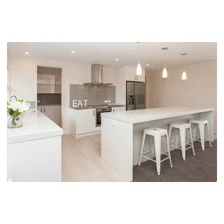 White Corian benches with stainless steel cooking area - Contemporary ...
