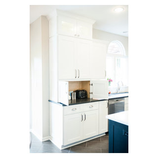White stacked shaker cabinets with Milky Way honed granite countertops ...
