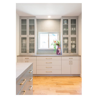 Window Over the Buffet Flanked by Full Height, Glass Front, Cabinets ...