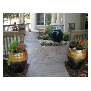 Southwestern pots and pot fountain in a courtyard - Southwestern ...