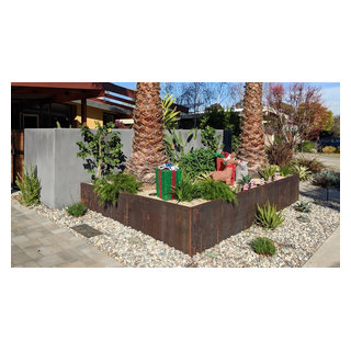 Secured Custom Steel Framed Gates with Slab Accent Garden Wall ...