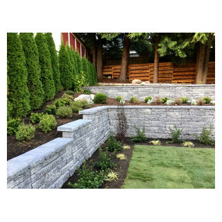 Stepped retaining walls that follow the natural slope - Modern ...