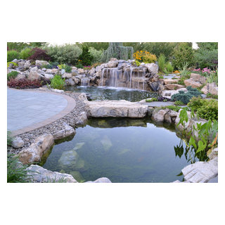 The first of two ponds, this smaller pond with stepping stone bridge ...